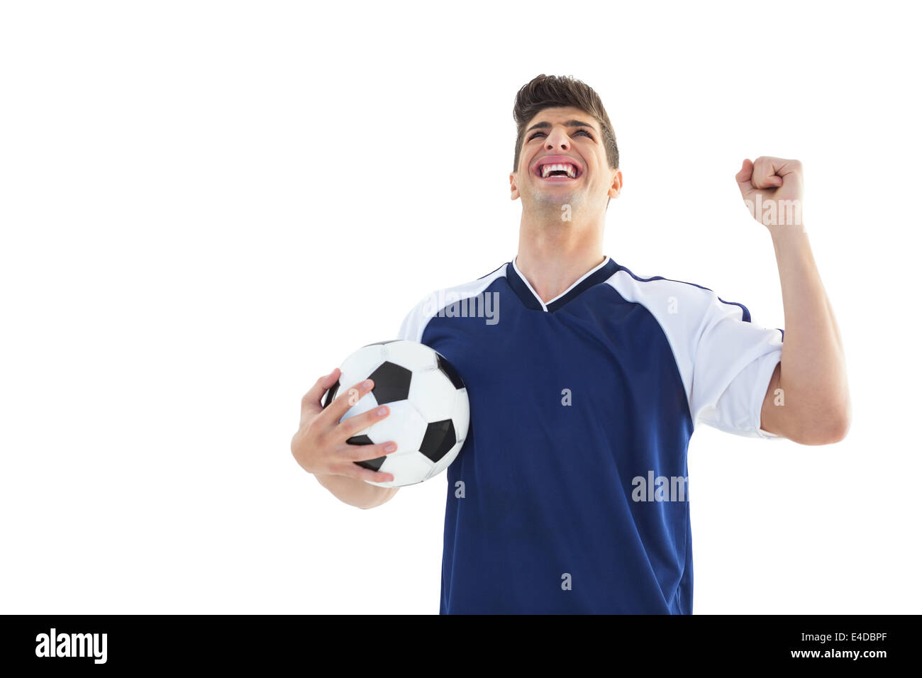 Football player in blue celebrating Stock Photo - Alamy