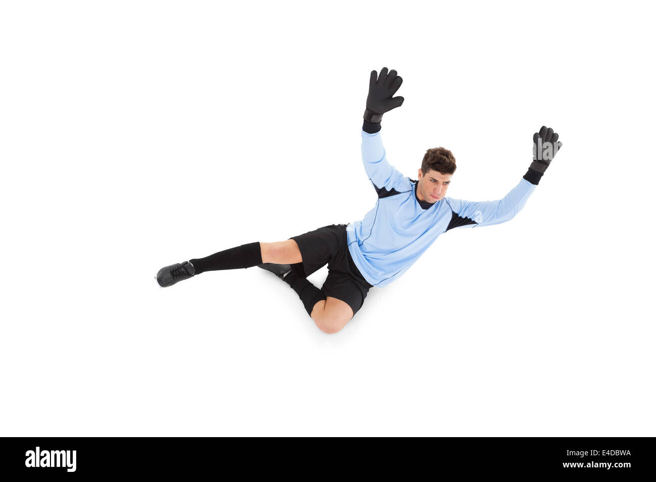 Goalkeeper in blue making a save Stock Photo - Alamy