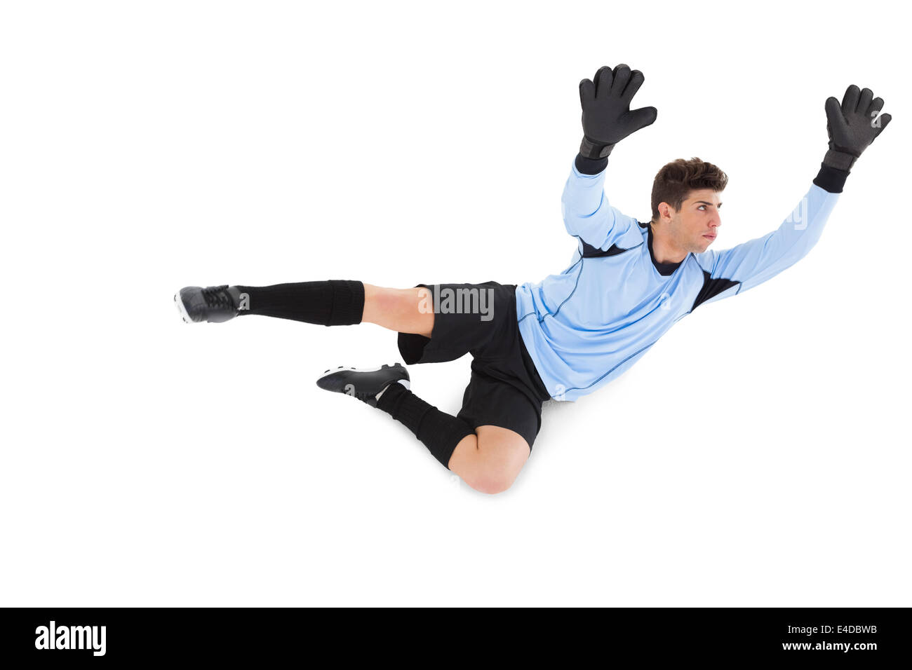 Goalkeeper in blue making a save Stock Photo - Alamy