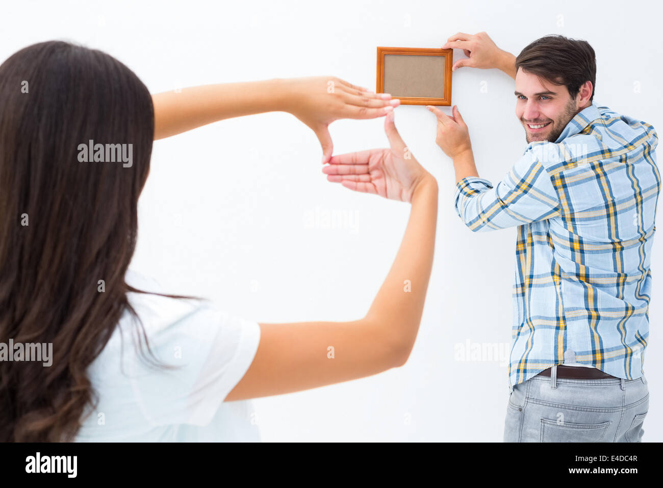 Putting up picture hi-res stock photography and images - Alamy