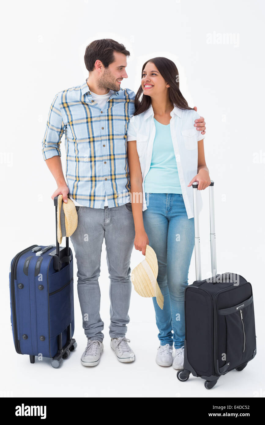 Attractive young couple going on their holidays Stock Photo - Alamy