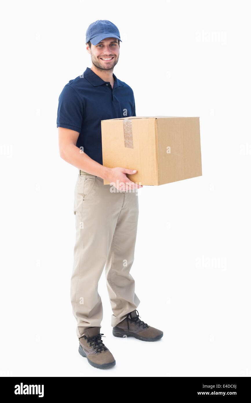 Happy delivery man holding cardboard box Stock Photo - Alamy