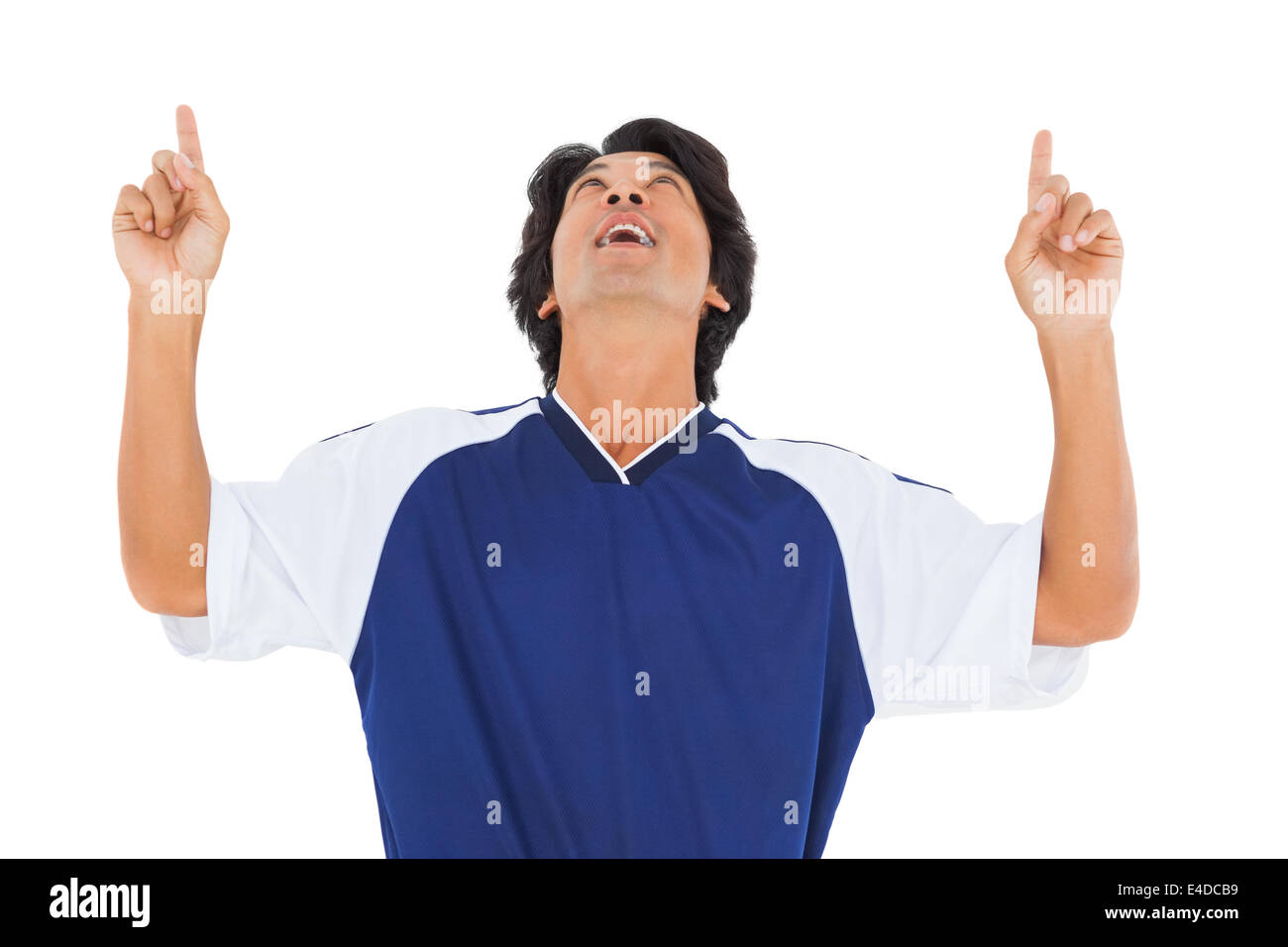 Football player in blue pointing up Stock Photo - Alamy