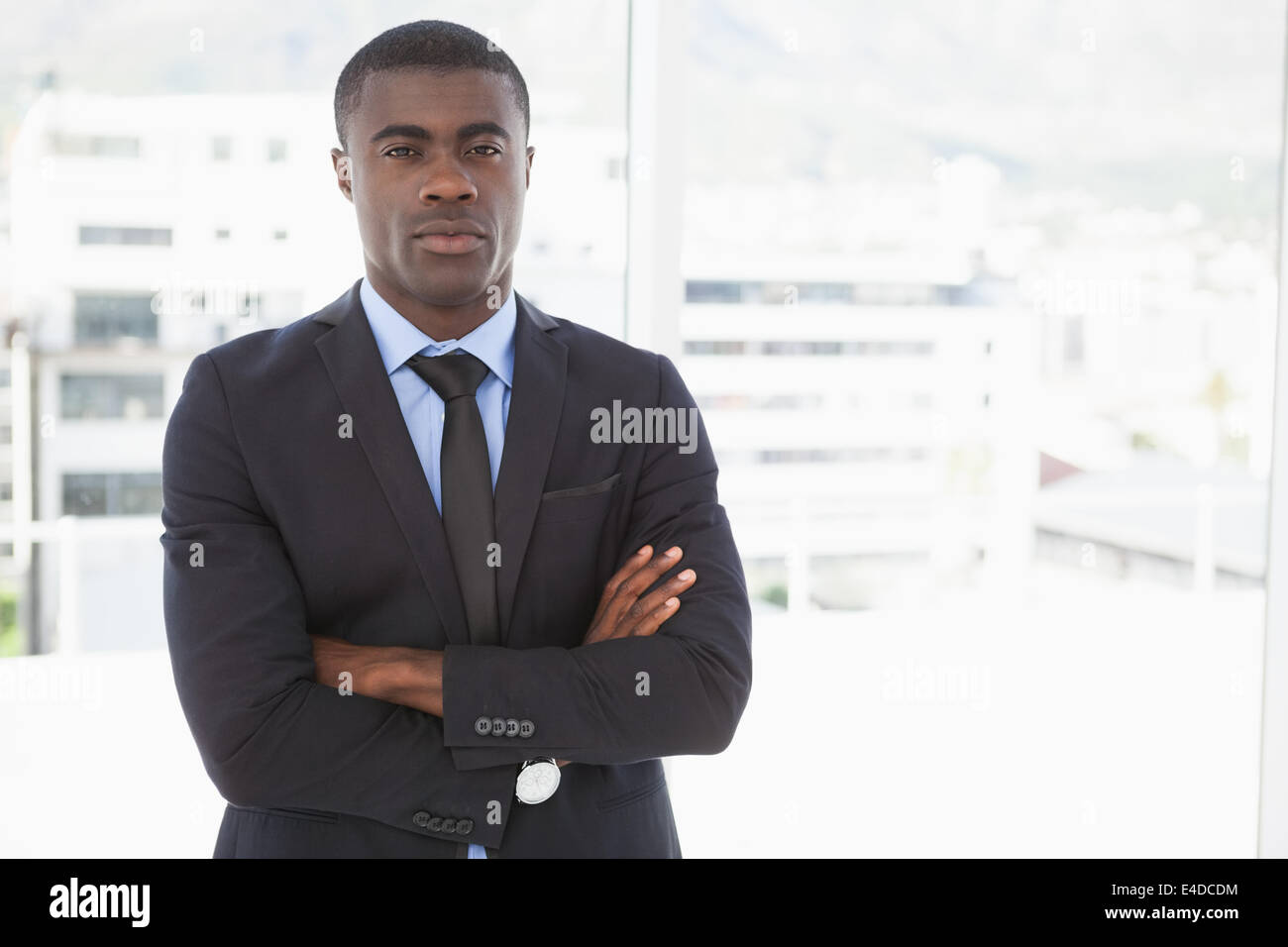 Handsome businessman frowning at camera Stock Photo - Alamy