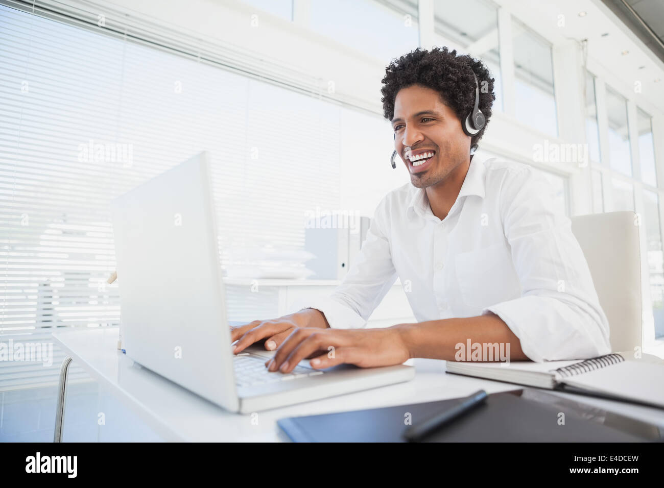 Businessman using headset while working hi-res stock photography and ...