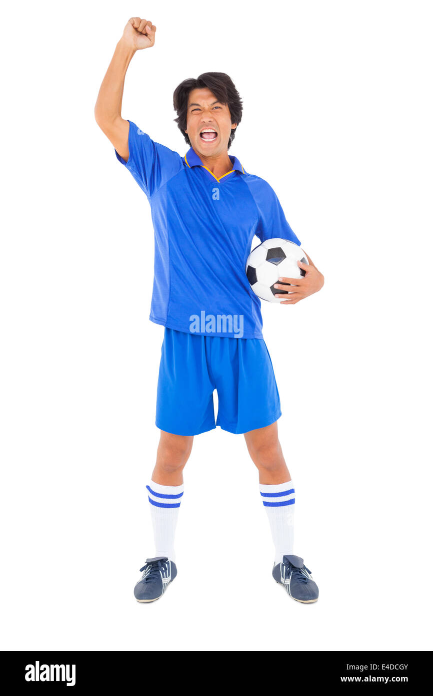 Football player in blue celebrating a victory Stock Photo - Alamy