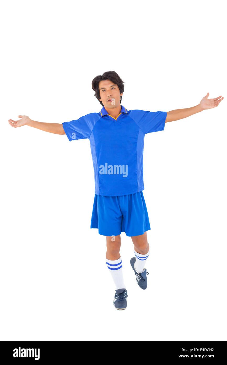 Football player in blue celebrating a victory Stock Photo - Alamy