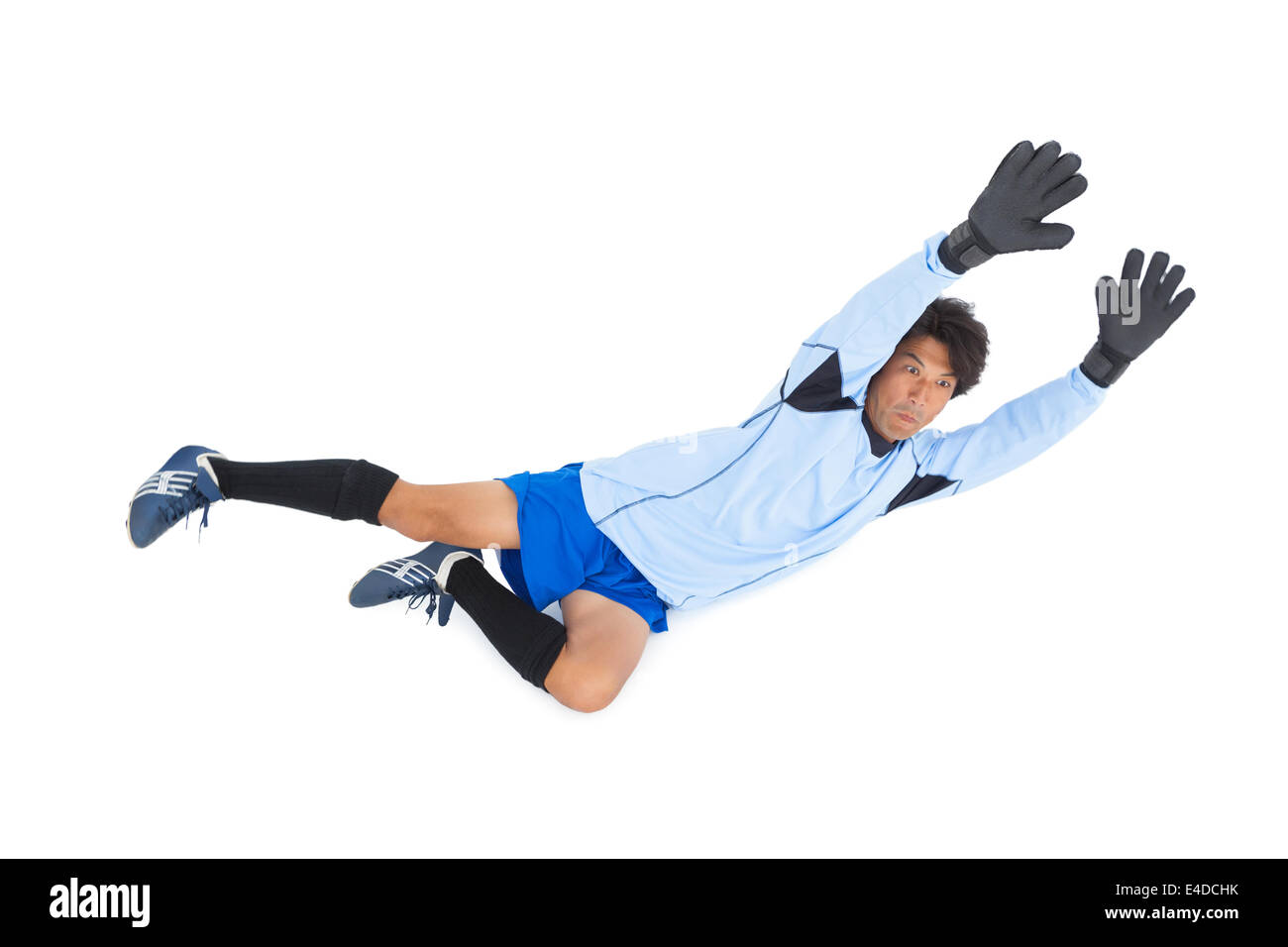 Goalkeeper in blue making a save Stock Photo - Alamy