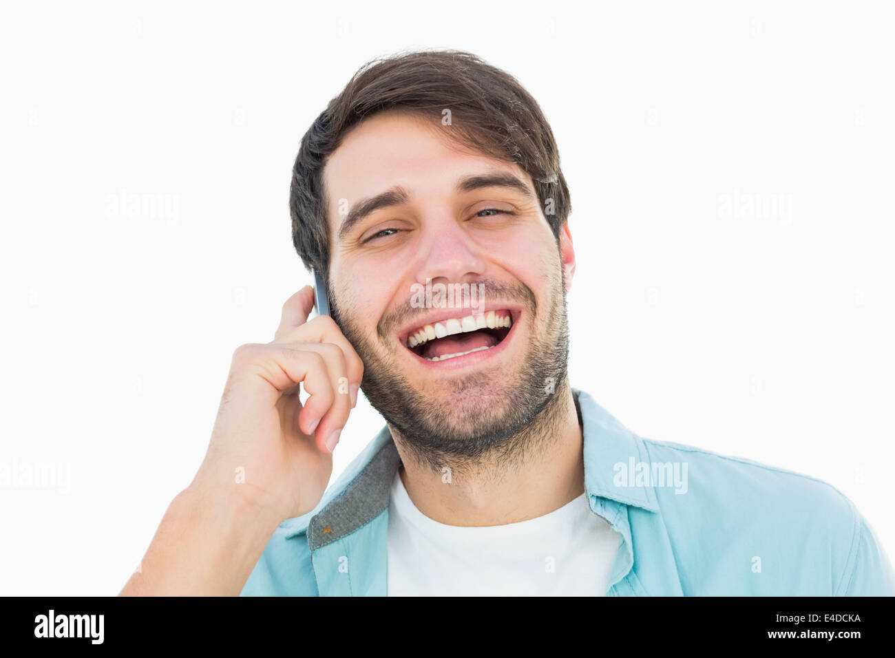 Happy casual man talking on phone Stock Photo - Alamy