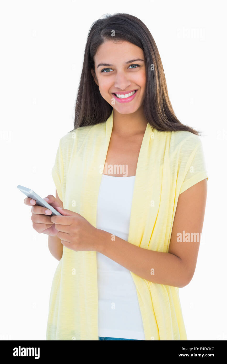 Happy casual woman sending a text Stock Photo - Alamy