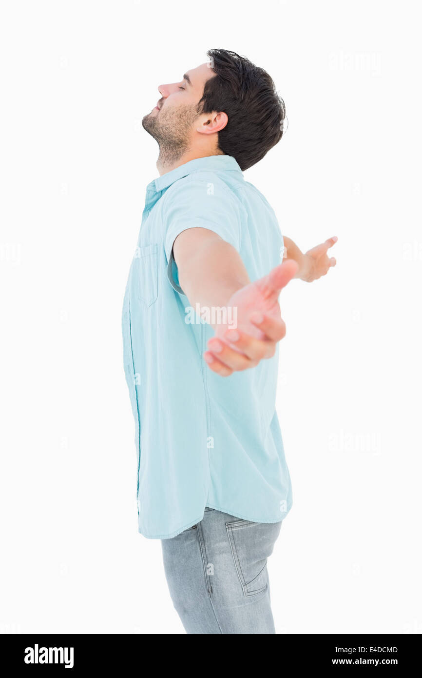 Happy casual man standing with arms out Stock Photo - Alamy