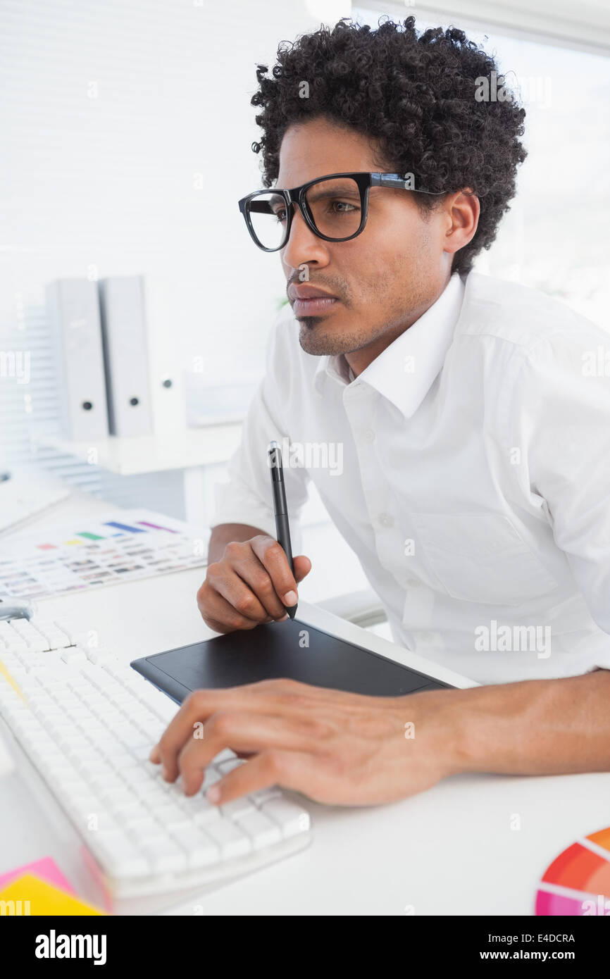 Hipster designer working at his desk Stock Photo - Alamy