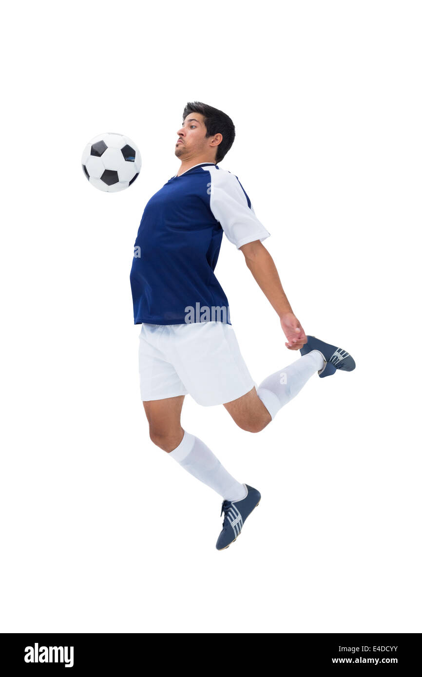 Football player in white playing Stock Photo - Alamy