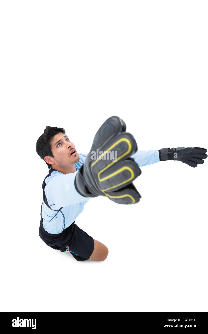 Goalkeeper in blue making a save Stock Photo - Alamy