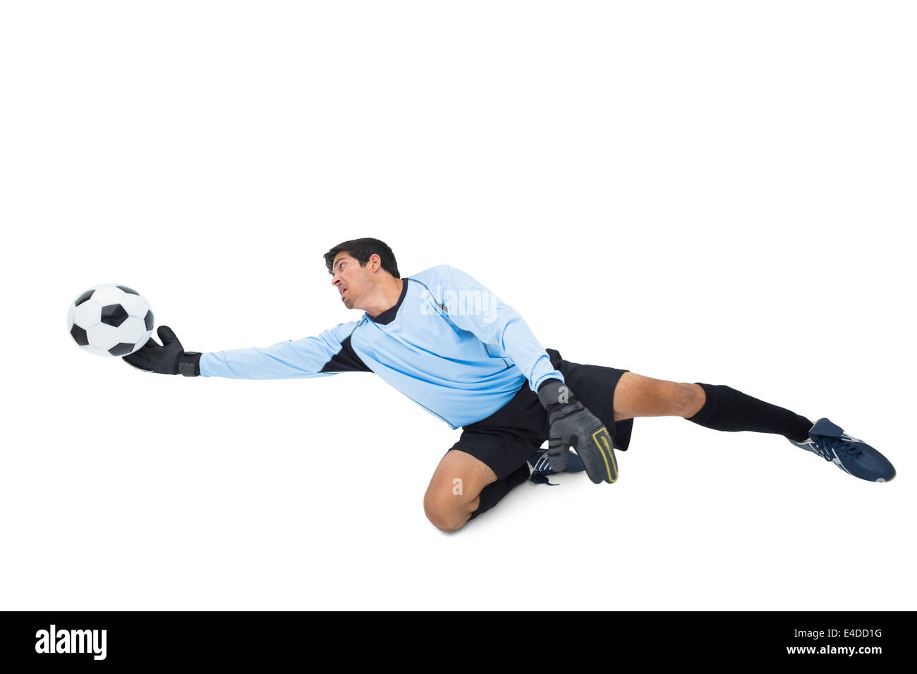 Goalkeeper in blue making a save Stock Photo - Alamy
