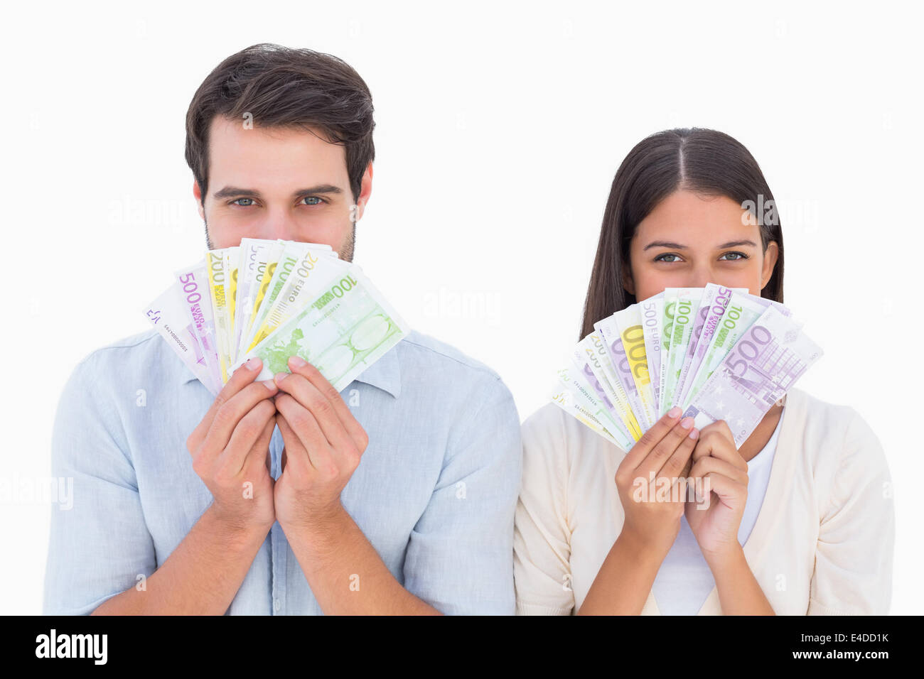 Happy couple showing their money Stock Photo - Alamy
