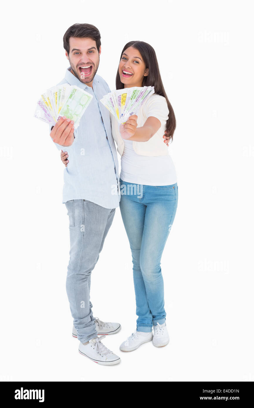 Happy couple showing their money Stock Photo - Alamy
