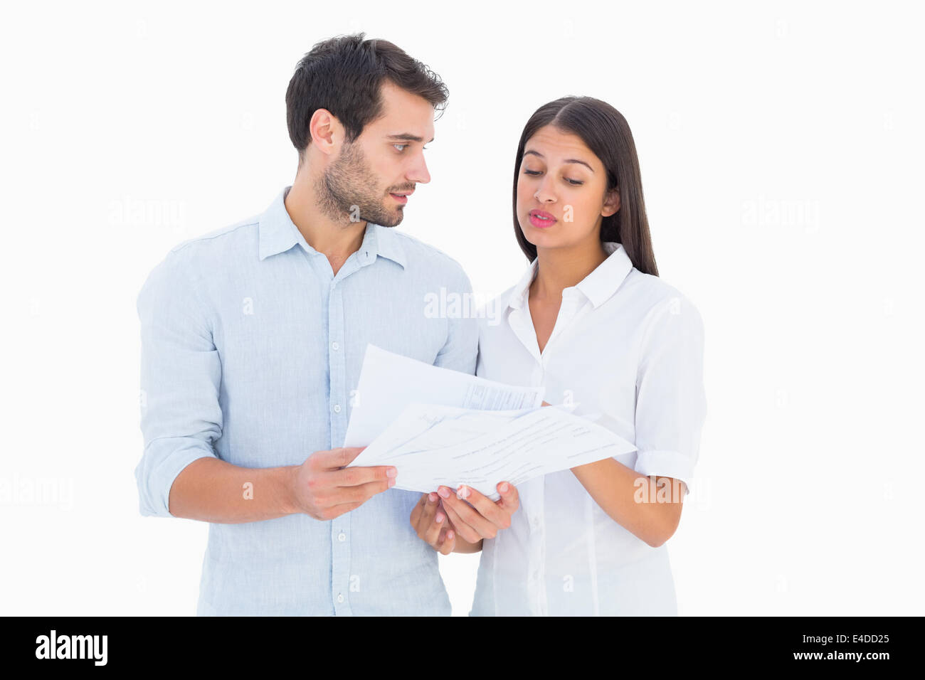 Attractive young couple reading their bills Stock Photo - Alamy