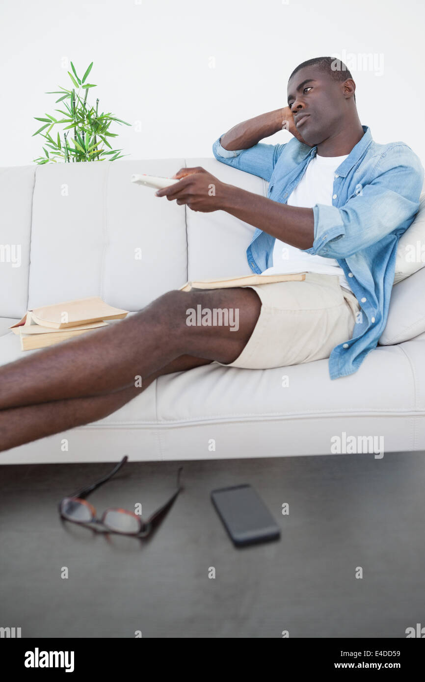 People Sitting On Couch Watching Tv