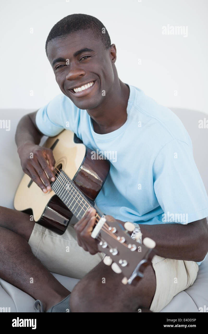 Black man playing guitar hi-res stock photography and images - Alamy