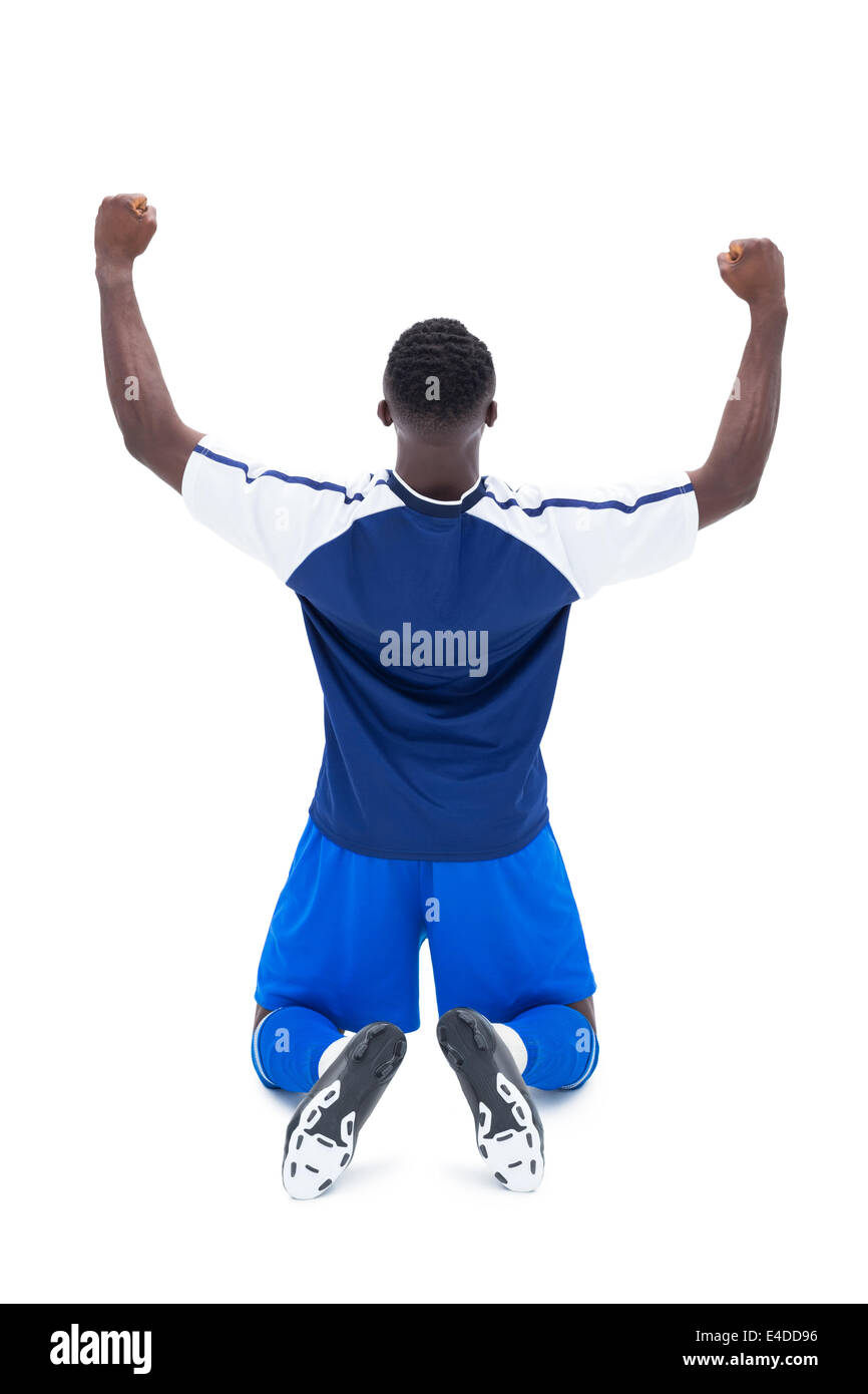 Football player in blue celebrating a win Stock Photo - Alamy