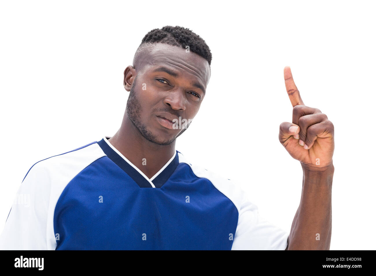 Football player in blue pointing up Stock Photo - Alamy
