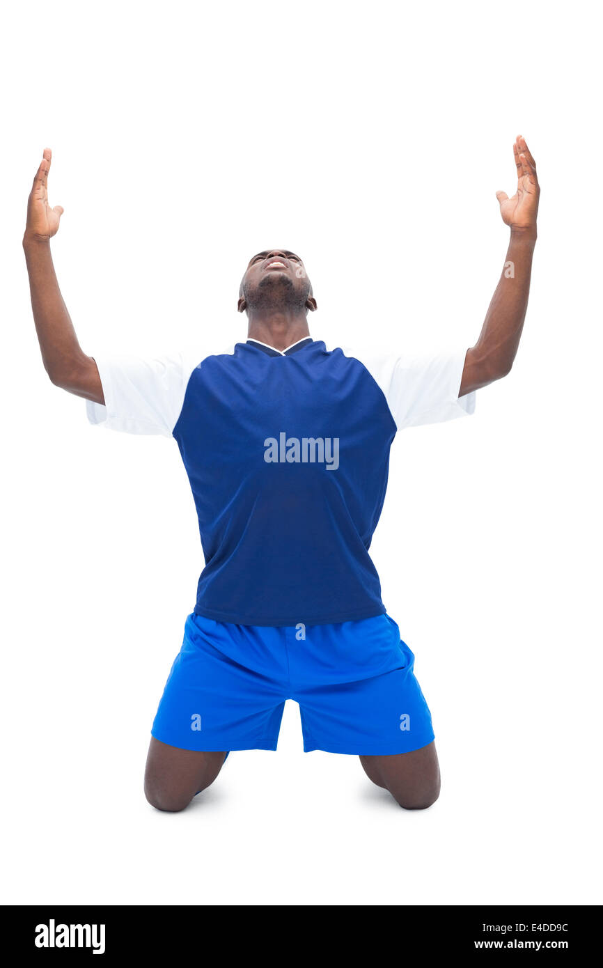 Football player in blue celebrating a win Stock Photo - Alamy