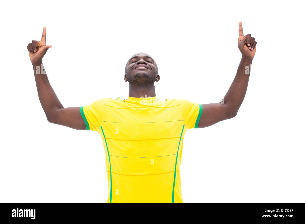 Football player in yellow celebrating a win Stock Photo - Alamy