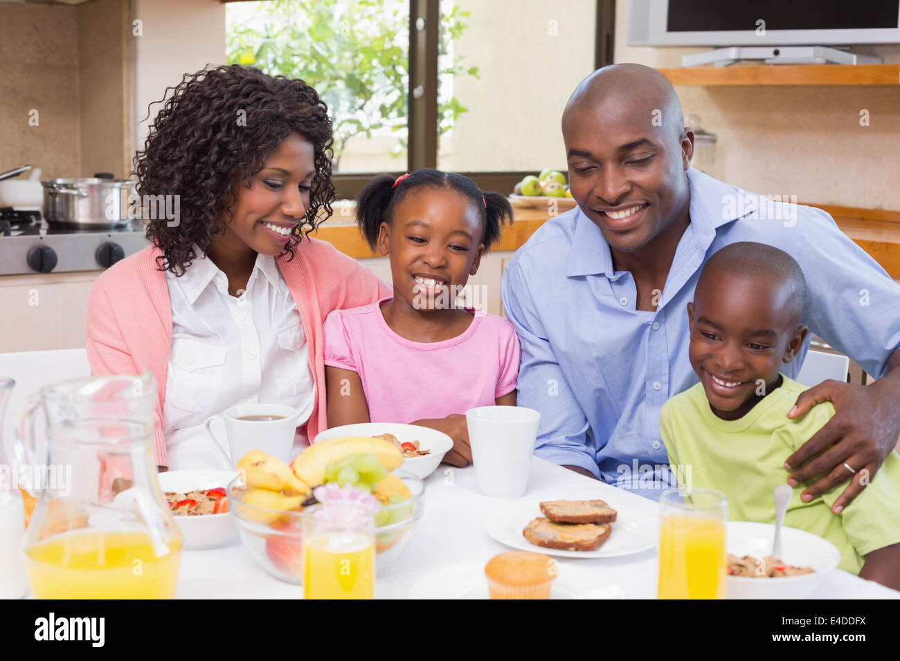 Happy family having breakfast together in the morning Stock Photo - Alamy