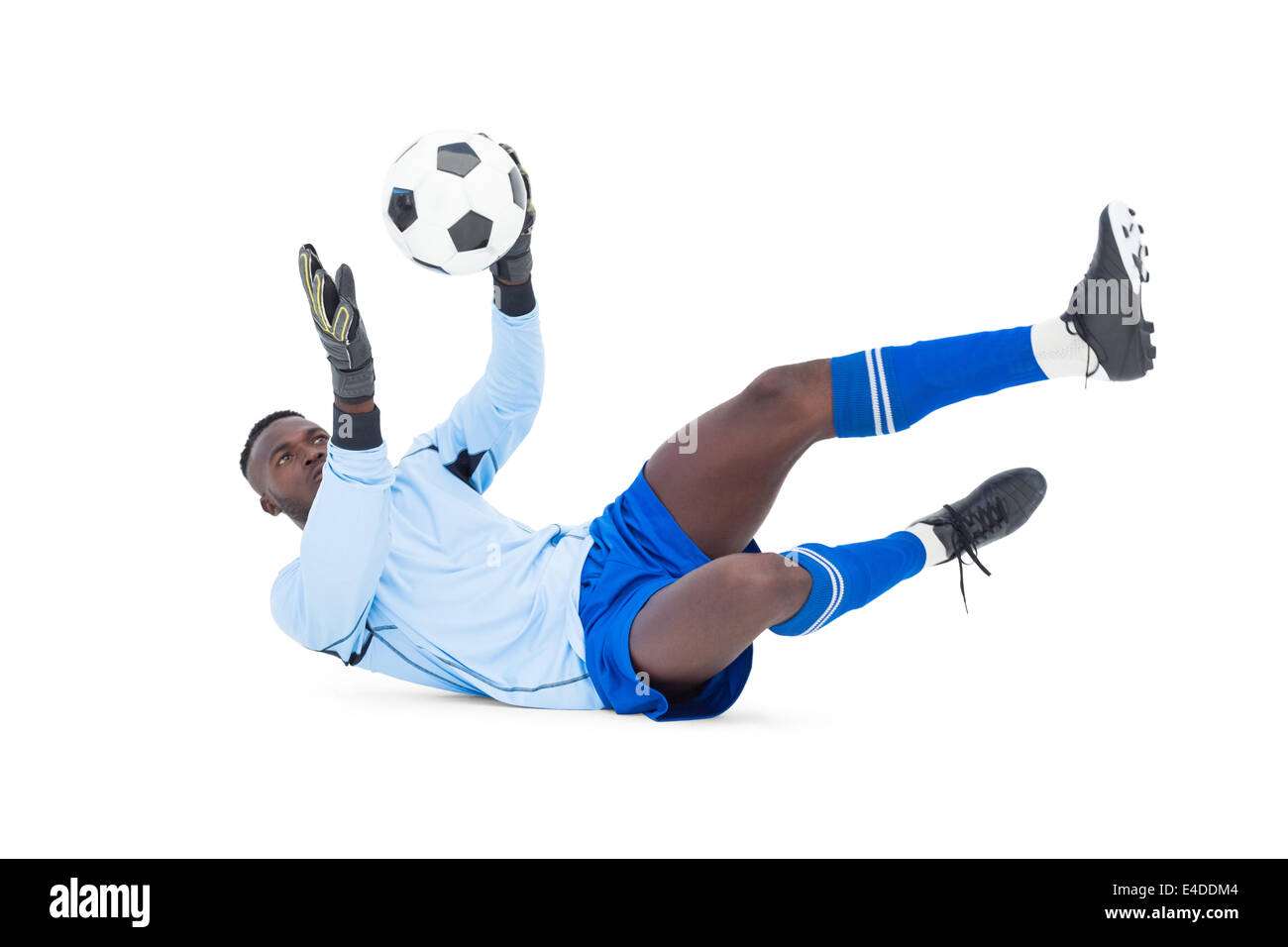 Goalkeeper in blue making a save Stock Photo - Alamy