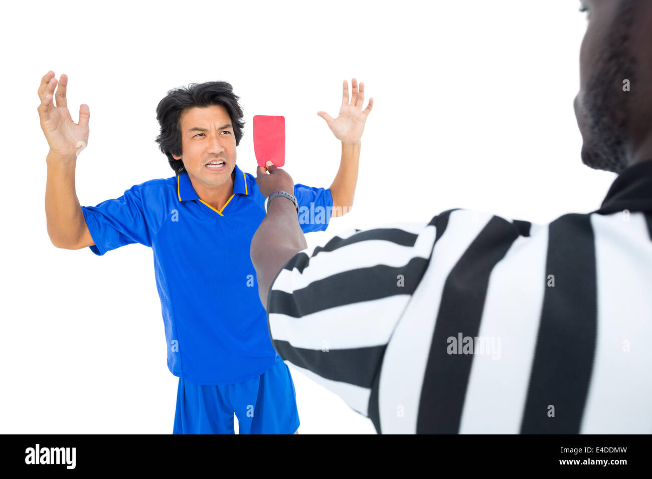Serious referee showing red card to player Stock Photo - Alamy