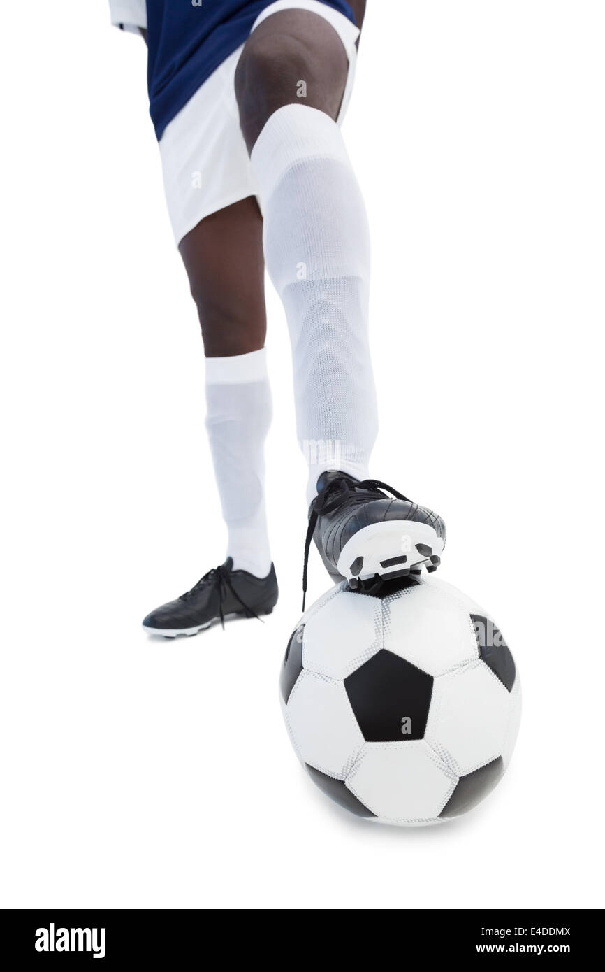 Football player standing with the ball Stock Photo - Alamy
