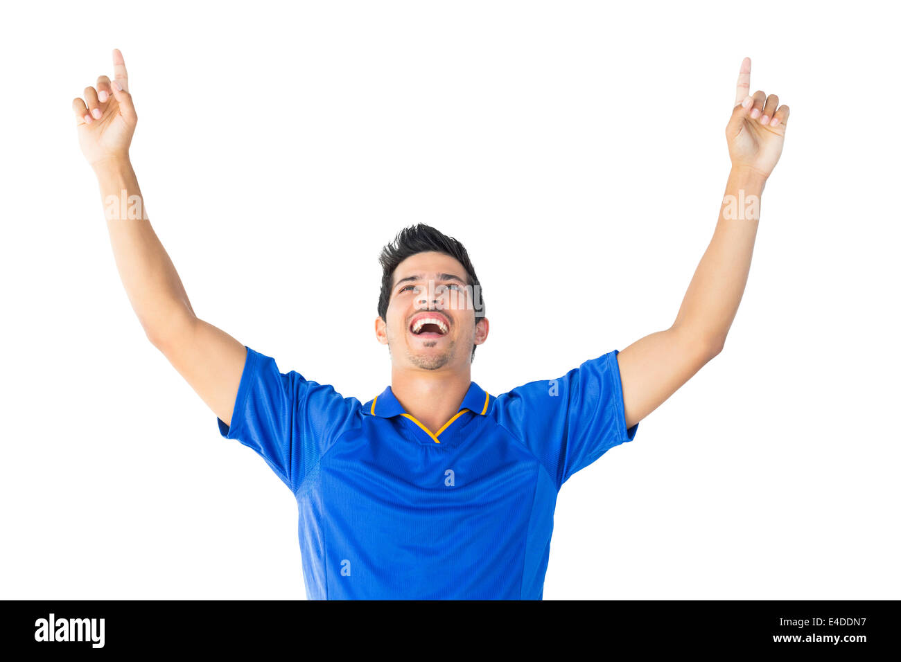 Happy football player in blue celebrating Stock Photo - Alamy