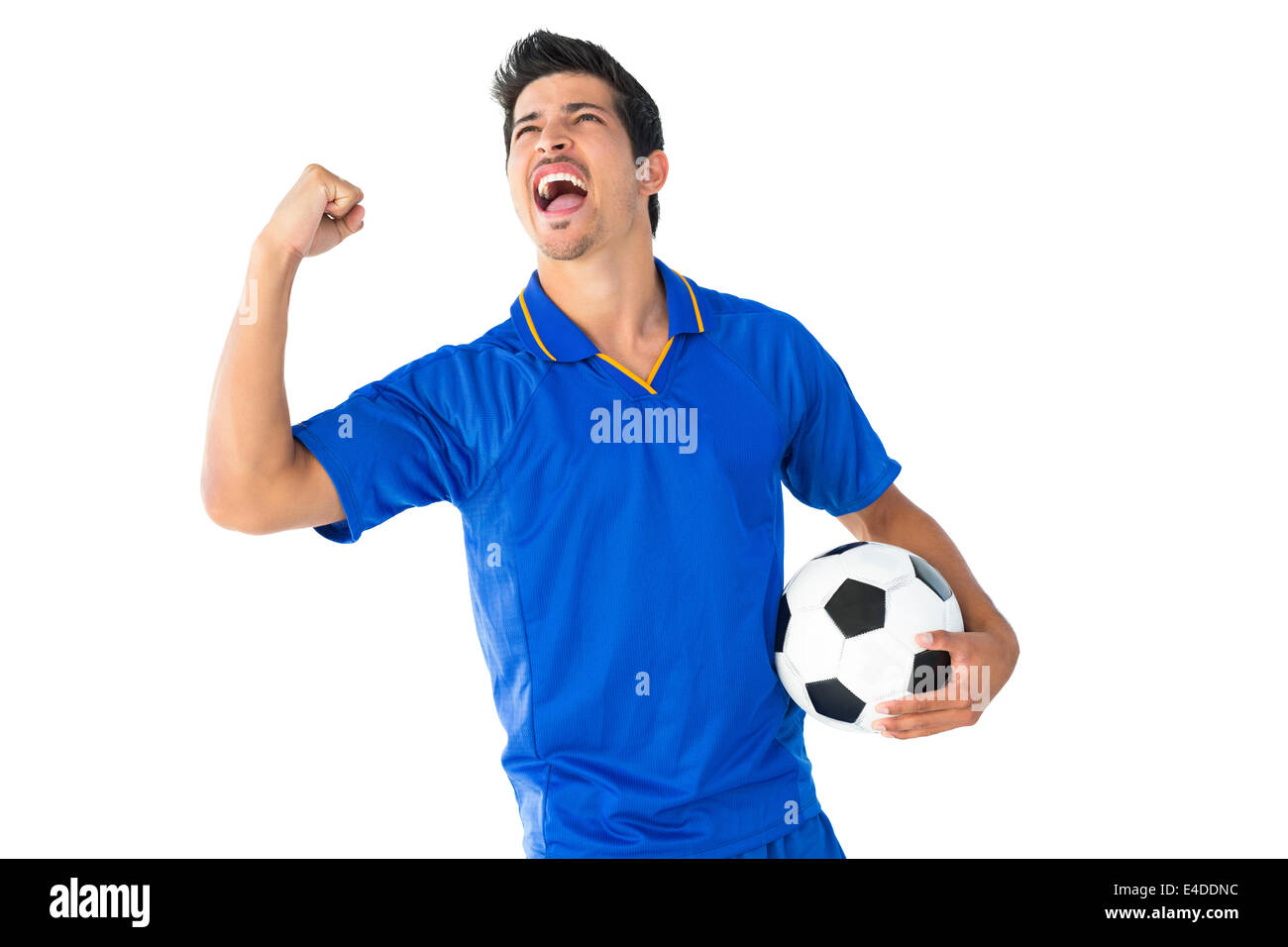 Happy football player in blue celebrating Stock Photo - Alamy