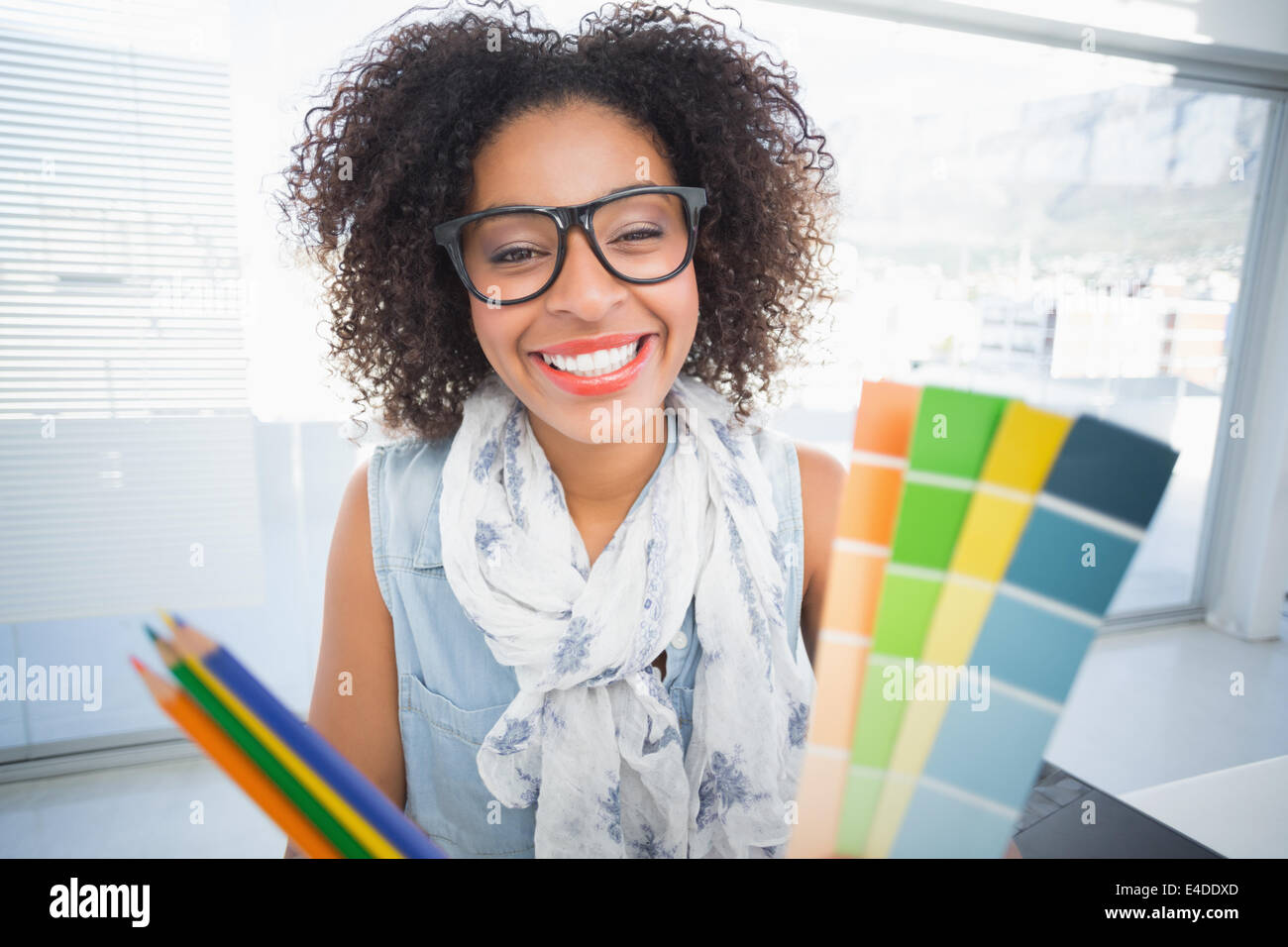 Pretty designer working at her desk Stock Photo - Alamy