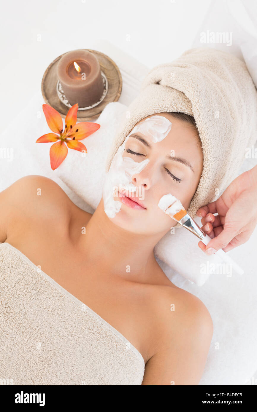 Attractive young woman receiving treatment at spa center Stock Photo ...