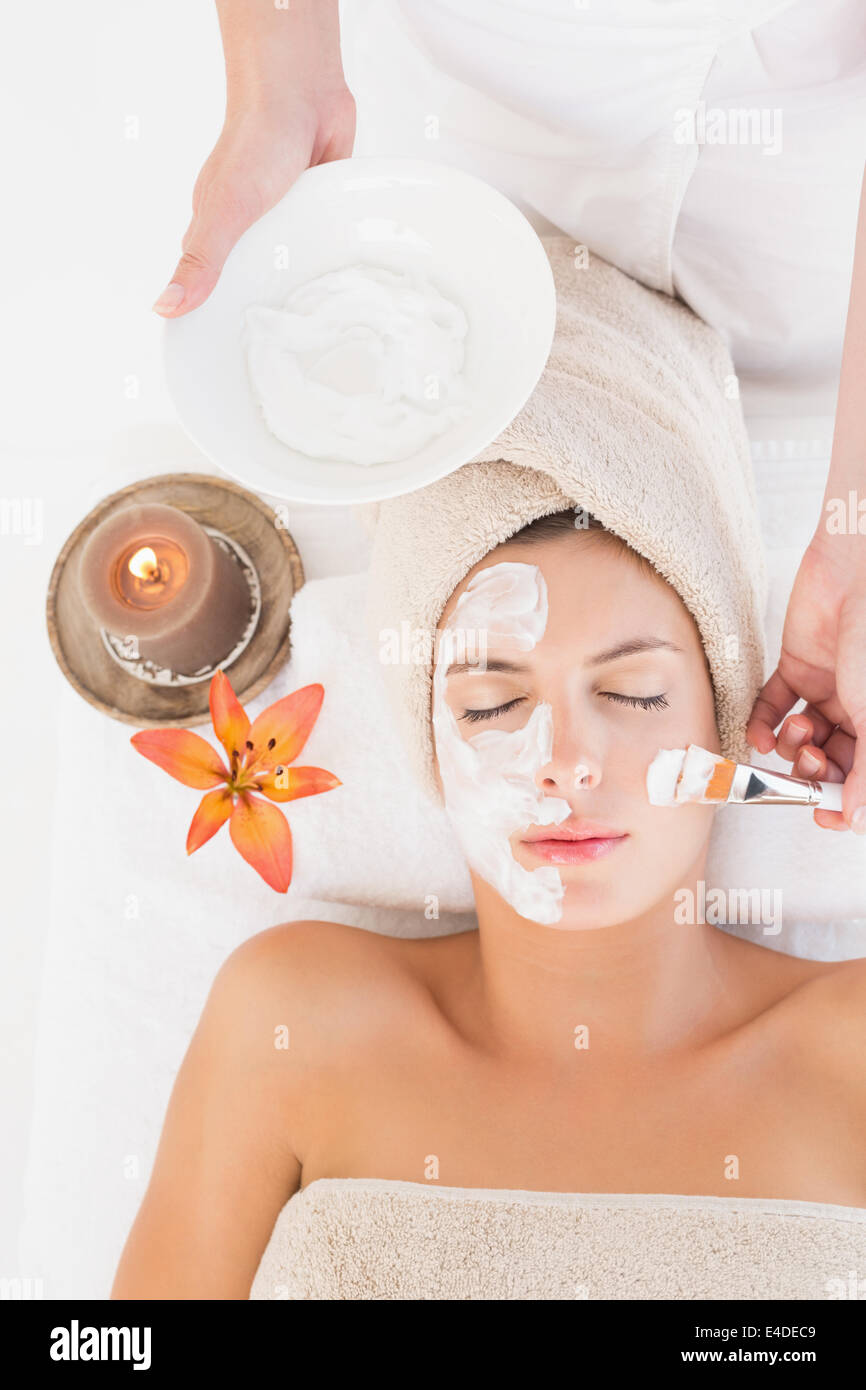 Attractive young woman receiving treatment at spa center Stock Photo ...