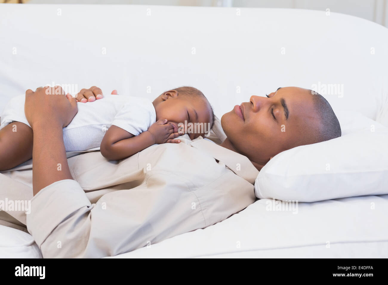 Baby sleeping on father hi-res stock photography and images - Alamy