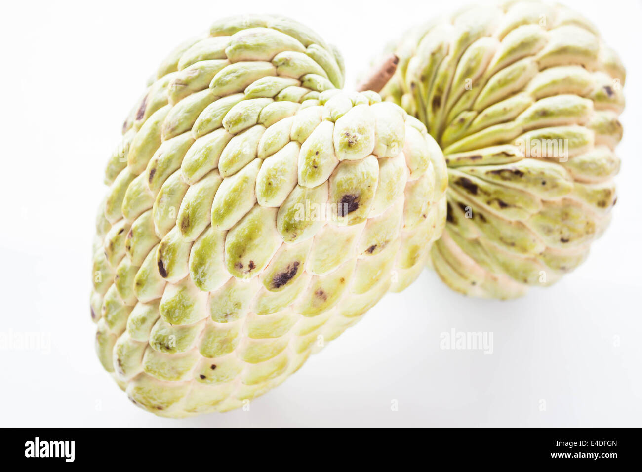 Couple fresh custard apple with green peel Stock Photo - Alamy