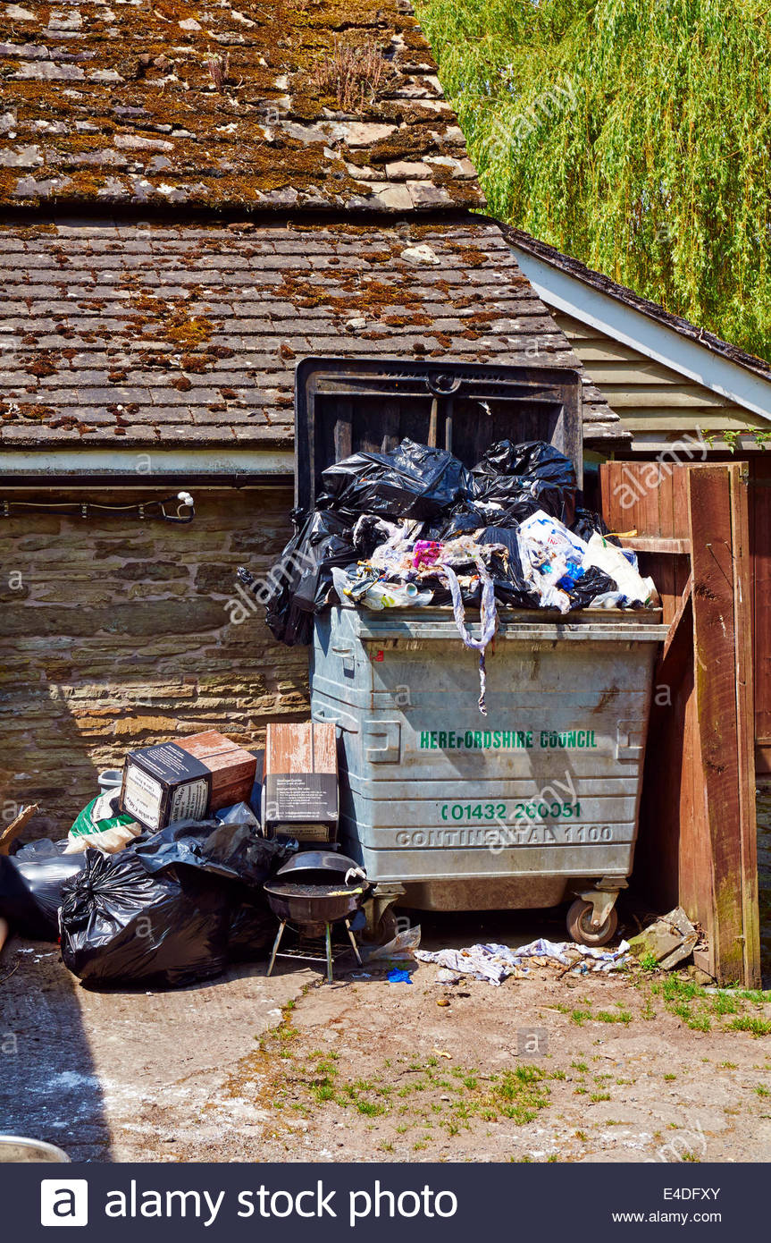 Garbage Outside A Garbage Container High Resolution Stock Photography ...