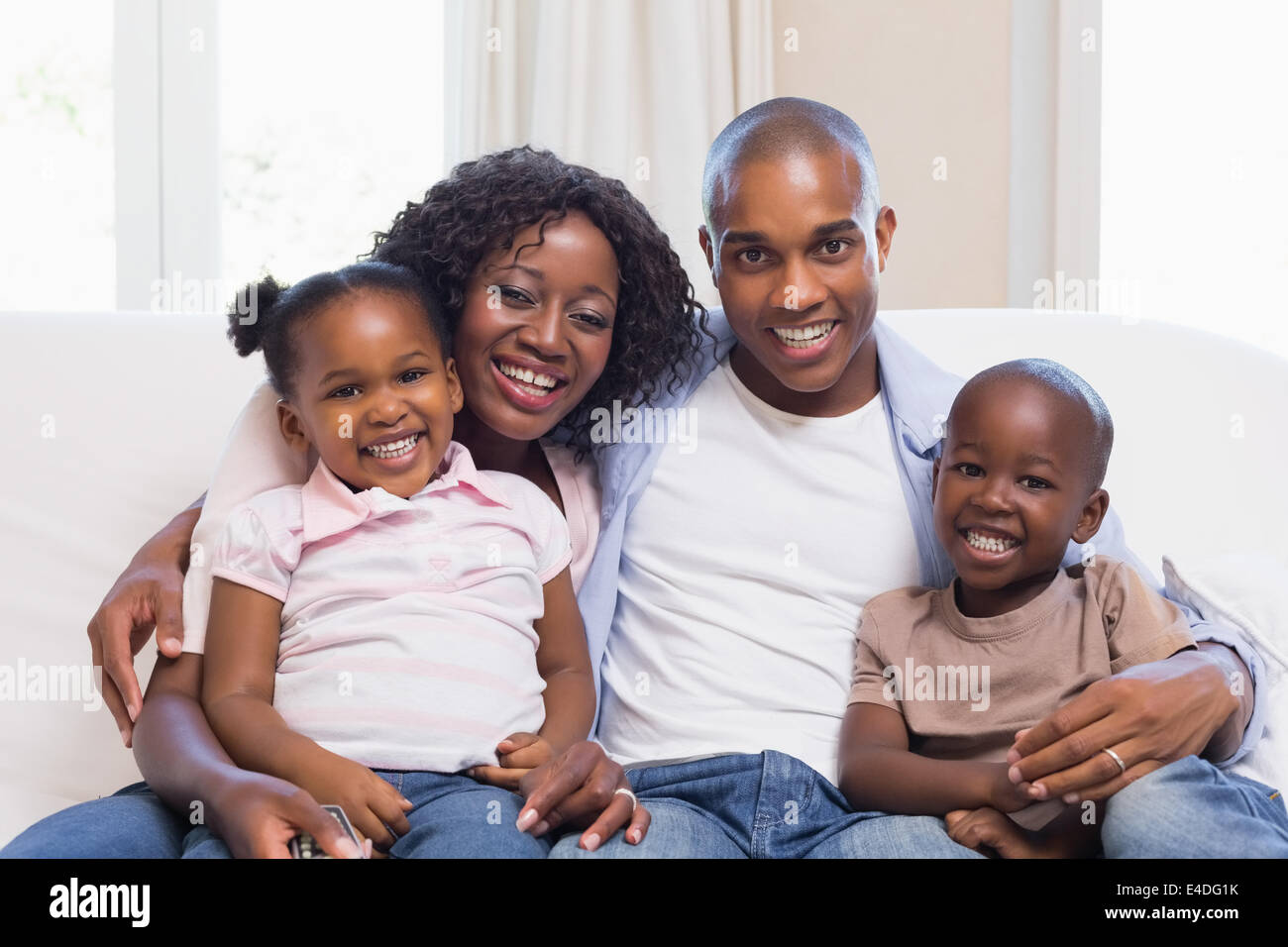 Happy family smiling together hi-res stock photography and images - Alamy