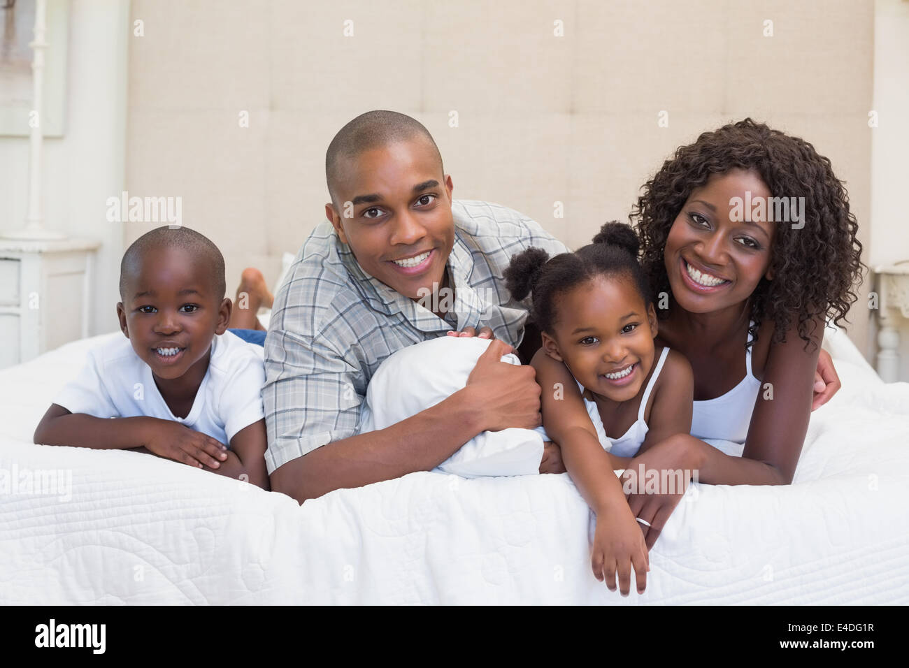 Happy family smiling together hi-res stock photography and images - Alamy