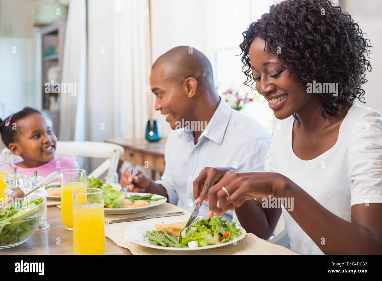 Happy family enjoying a healthy meal together Stock Photo - Alamy