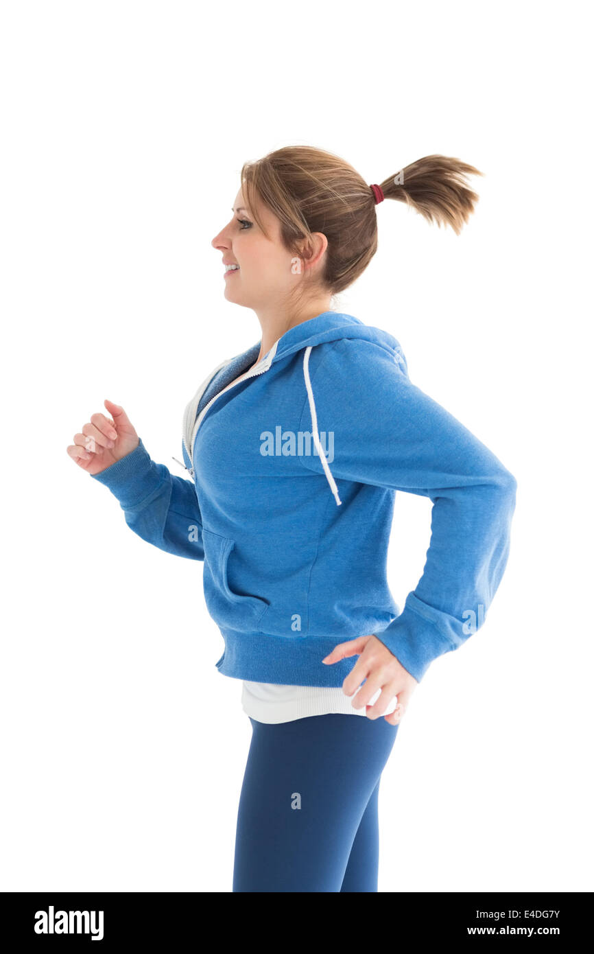 Side view of a young woman running Stock Photo - Alamy