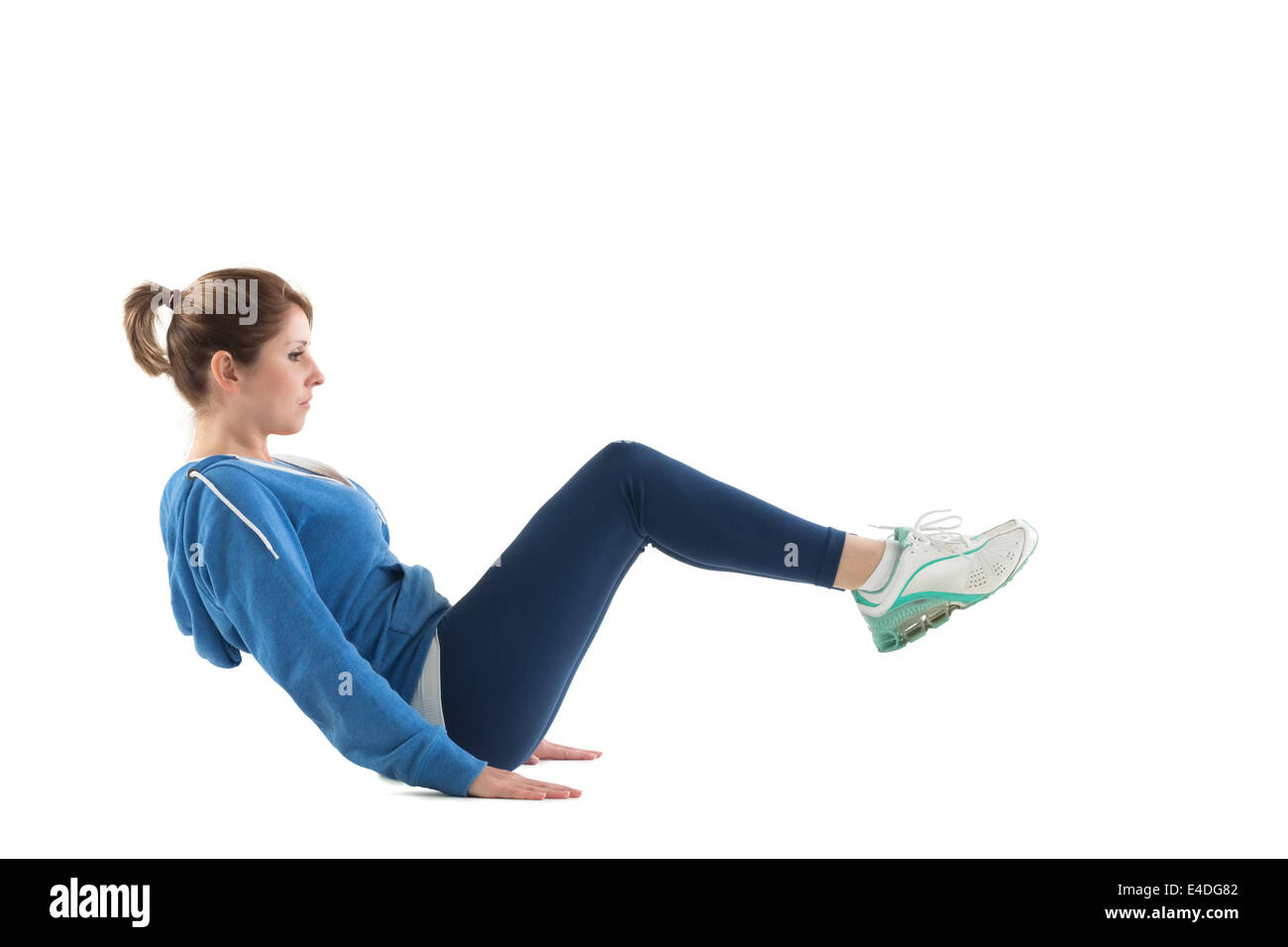 Side view of woman in core balance pilates pose Stock Photo - Alamy
