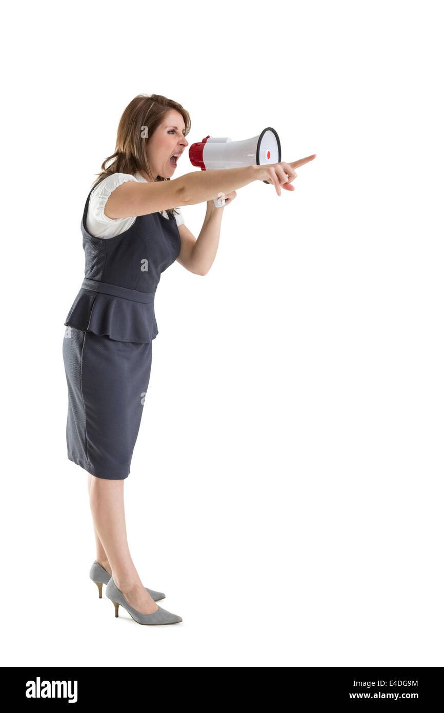 Young woman shouting into bullhorn as she gestures Stock Photo - Alamy
