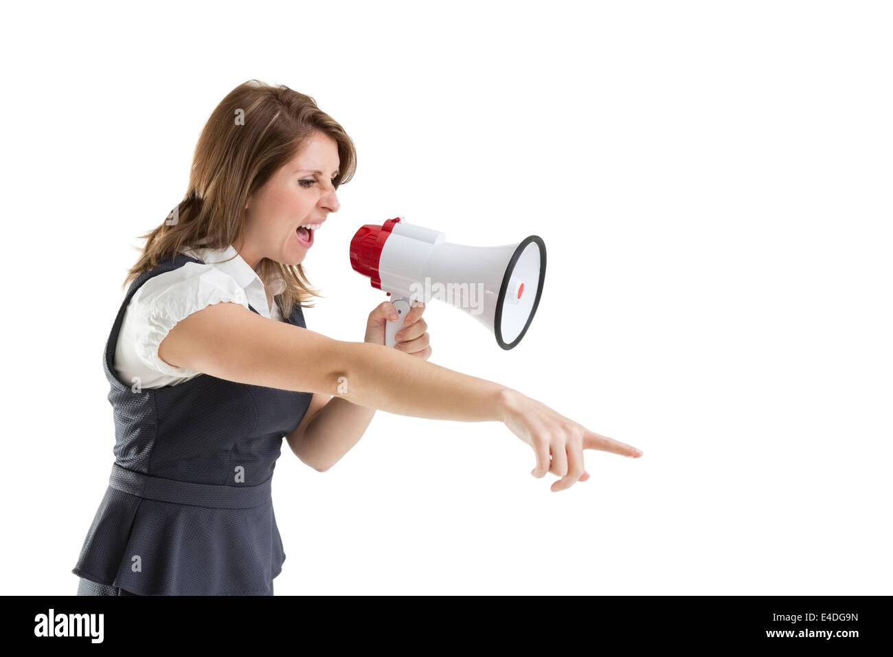 Young woman shouting into bullhorn as she gestures Stock Photo - Alamy