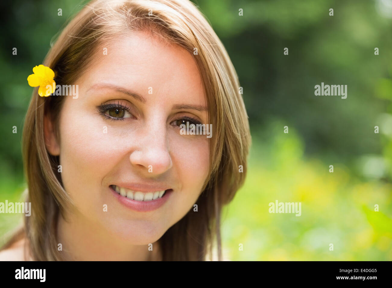 Cute young woman in field Stock Photo - Alamy