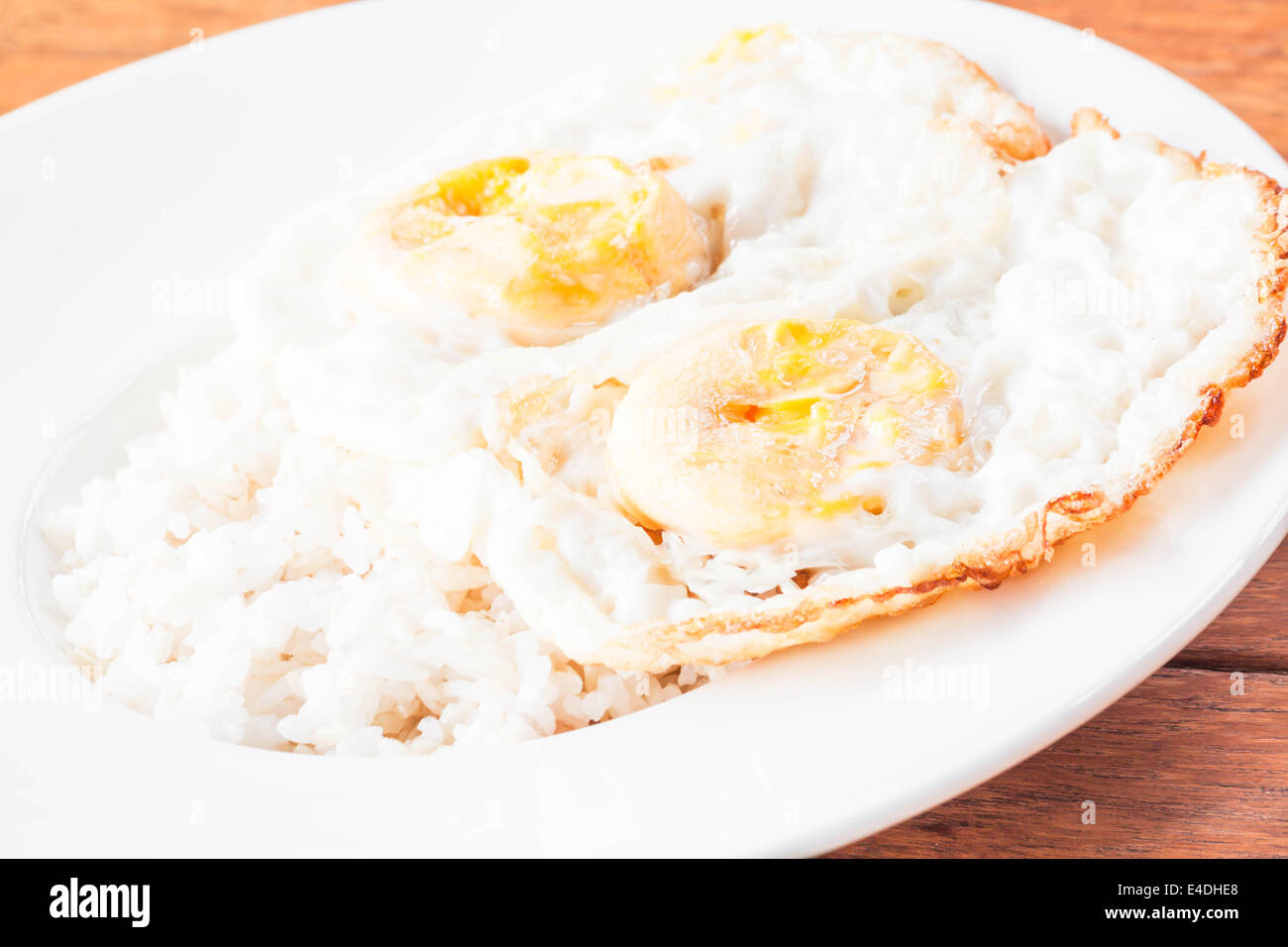 Double star eggs topped on rice up close Stock Photo - Alamy