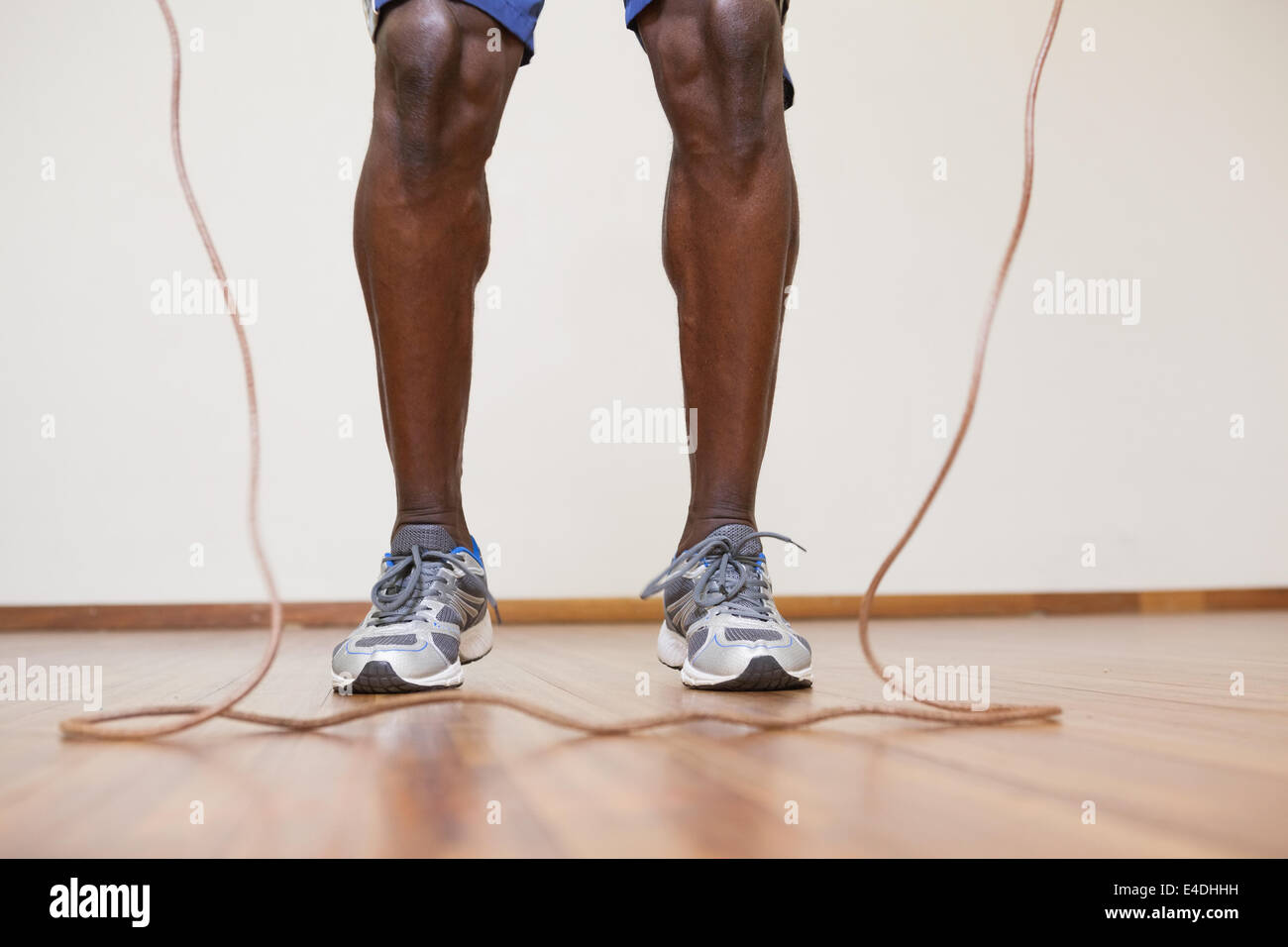 Muscular man skipping in gym Stock Photo - Alamy